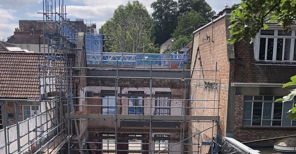 ‘Industry first’ as modular homes are lowered into existing building ...